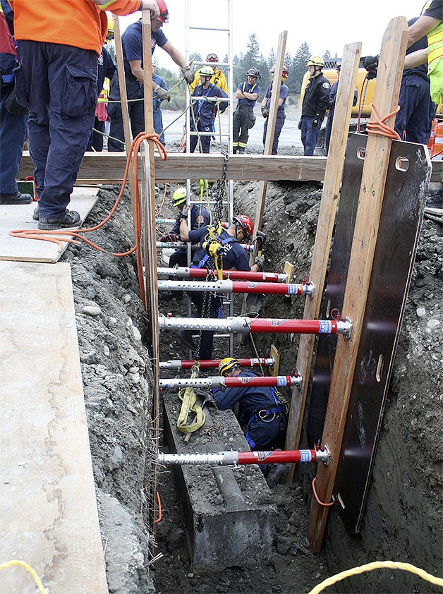 Firefighters learn the ins and outs of trench rescue | Covington-Maple ...